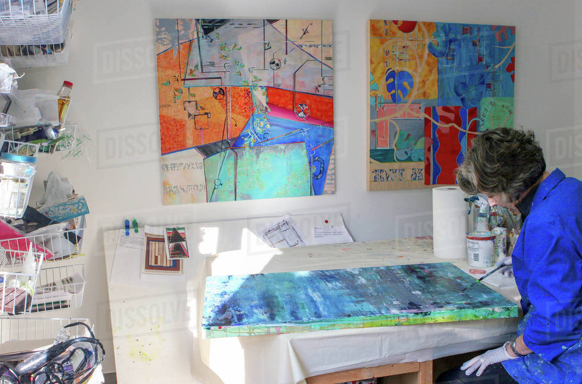 Artist painting canvas - Stock Photo - Dissolve