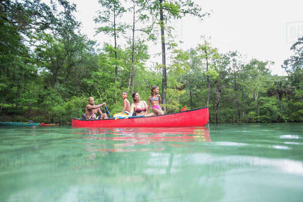 Family on a canoe trip together at Econfina Spring, Florida, USA ...