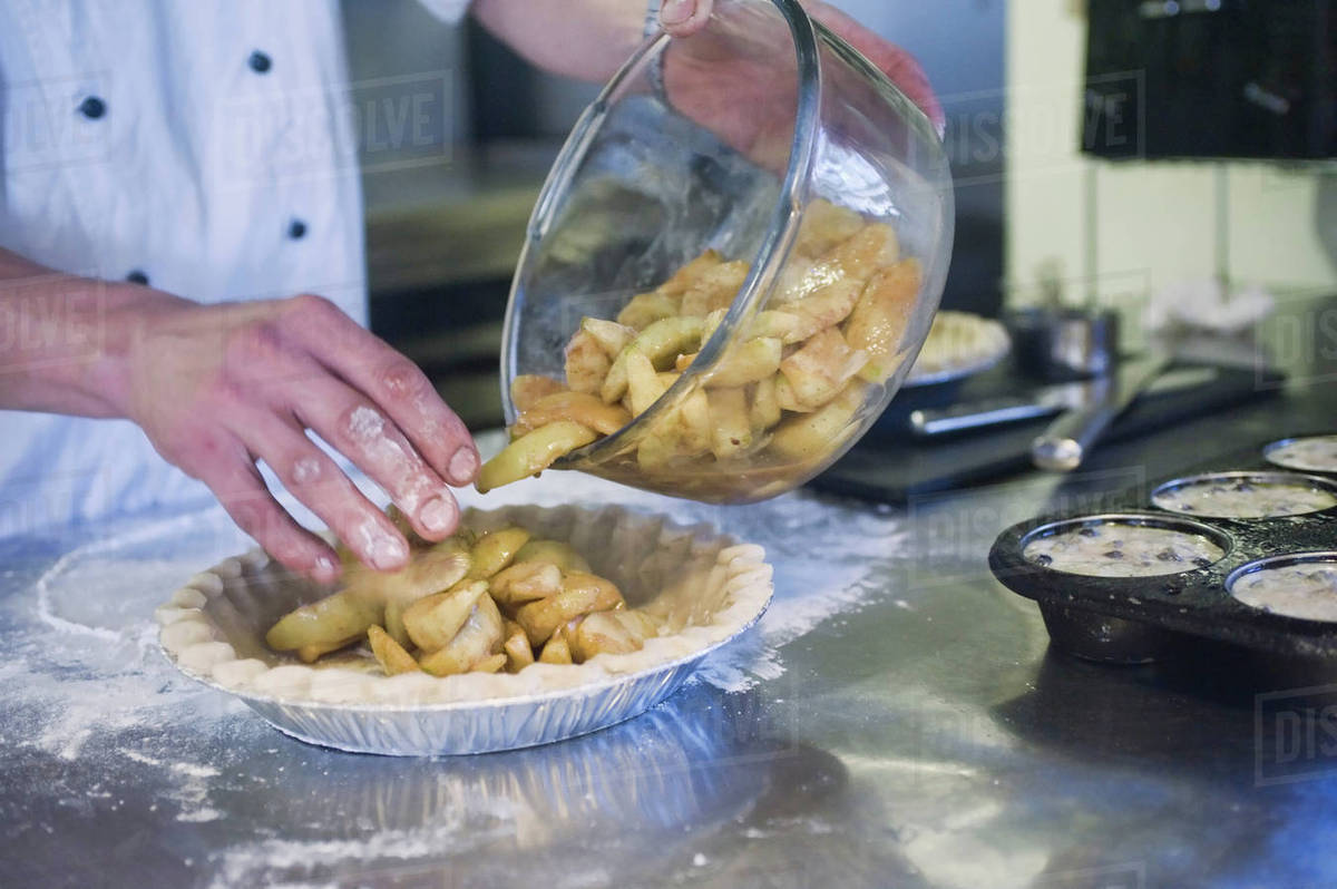 Chef baking pie in kitchen - Royalty-free Stock Photo | Dissolve