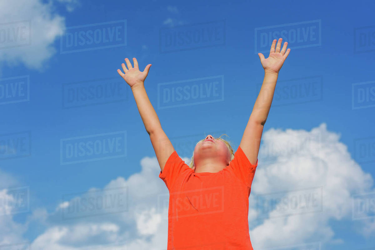 Young boy outdoors, reaching up towards sky - Royalty-free Stock Photo ...