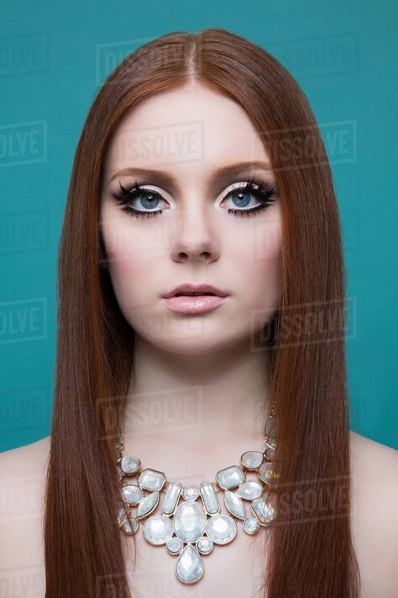 Portrait of woman wearing necklace - Stock Photo - Dissolve