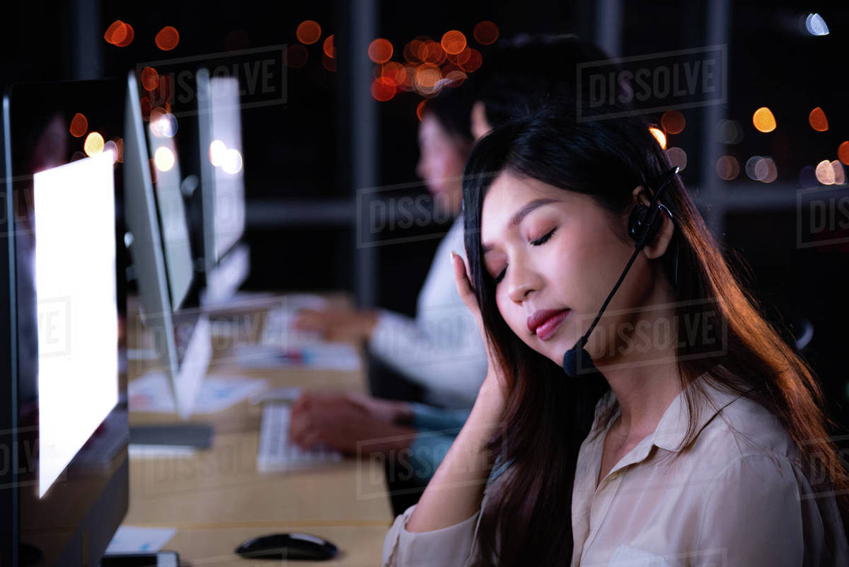 Asian call center business people get headache and migraine from ...