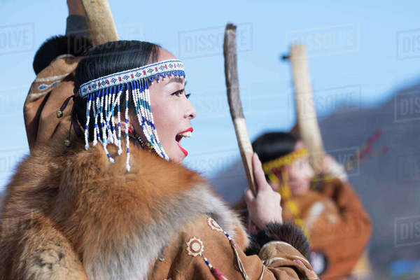 Woman dancing with tambourine in tradition clothing aboriginal people ...