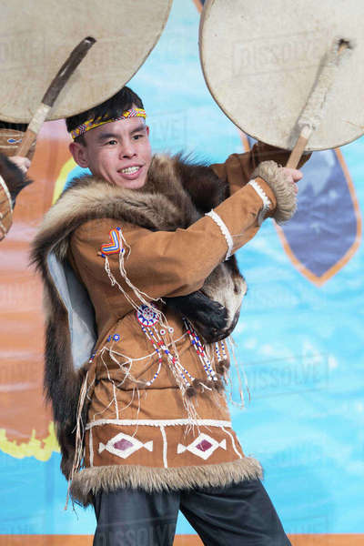 Male expression dancing with tambourine in tradition clothing ...