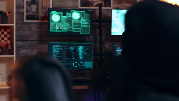 Zoom in shot organized cyber criminals in dark room with super ...