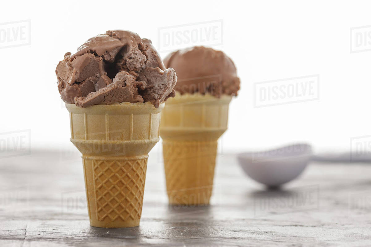 A close up of two chocolate ice cream cones. - Royalty-free Stock Photo ...