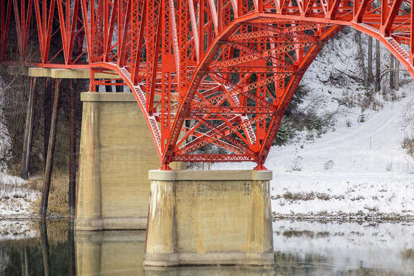 A close up of the support structure of a red bridge in Ione, Washington ...