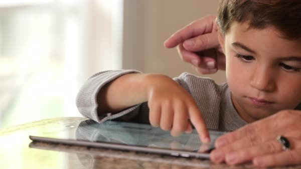 Mother and Son using digital tablet together - Stock Video Footage ...