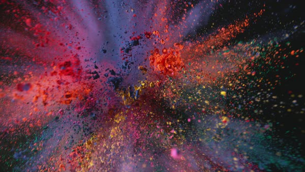 Colorful powder exploding on black background in super slow motion ...