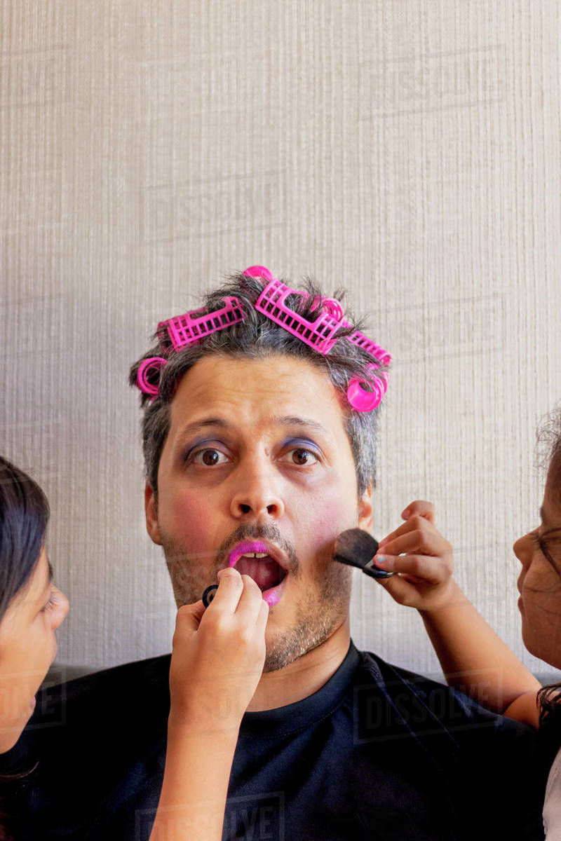 Handsome father is being makeup by the hands of his daughters - Royalty ...