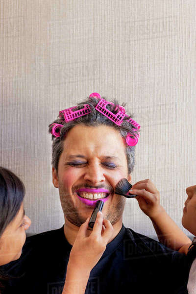 Handsome father is being makeup by the hands of his daughters - Royalty ...