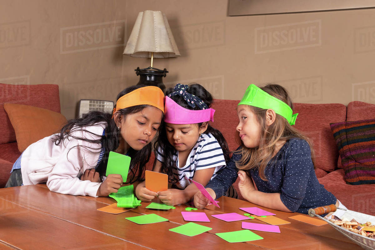 Girls playing with cards and colored chips - Royalty-free Stock Photo ...