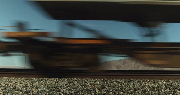 Medium shot of train moving on railroad track, Salton Sea, California ...
