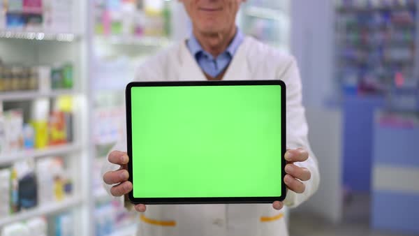Close-up green screen web page template in hands of unrecognizable ...