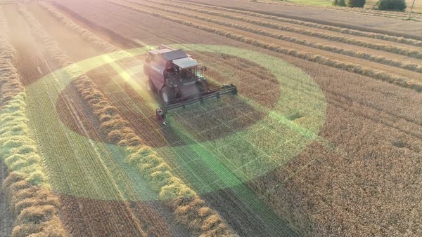 Electric combine, harvester removes oats, view from height, tracking ...