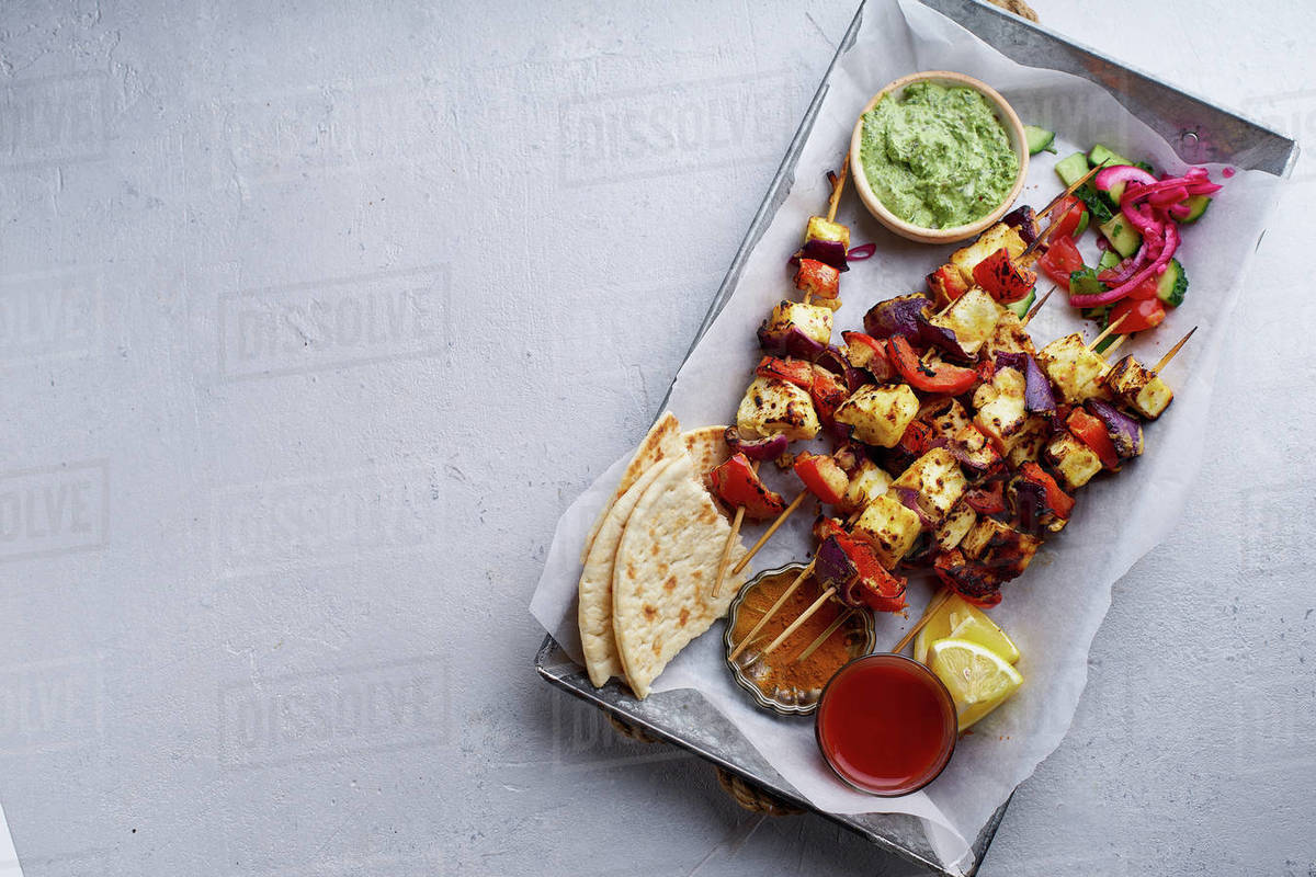 Paneer tikka starter kebabs with mint chutney and chapati. Traditional ...