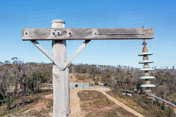 Drone aerial photograph of a telephone pole and wires in a forest ...