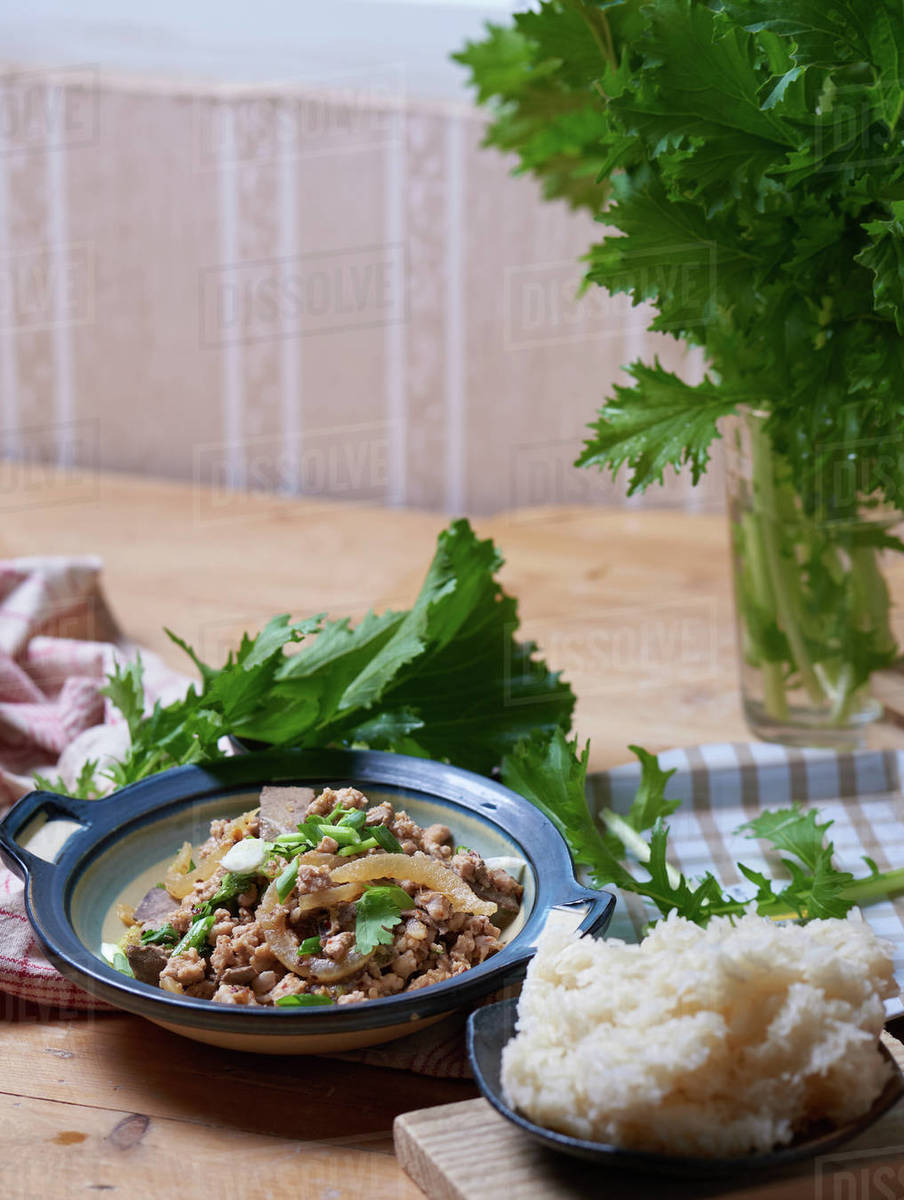 Larb Moo serving with sticky rice and vegetable - Royalty-free Stock ...