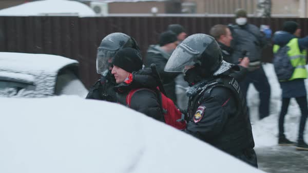 Aggressive arrest by riot police force officers. Violation of rights ...