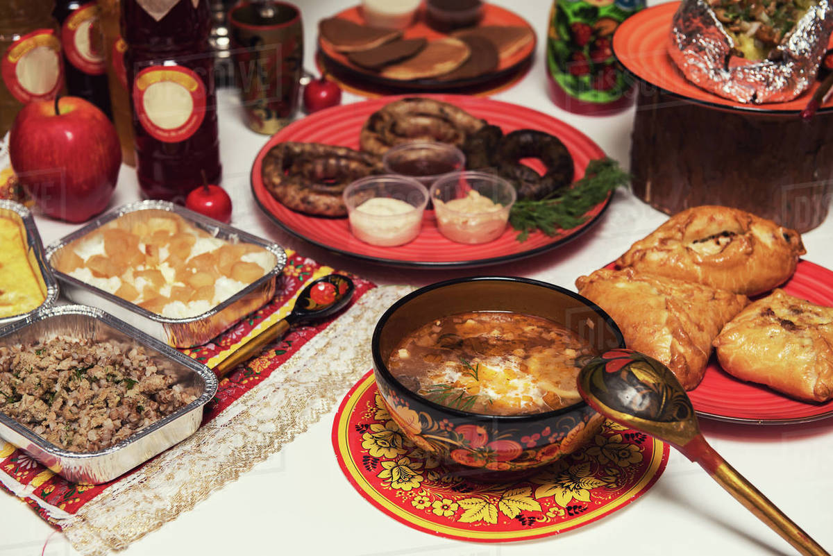 Table with traditional russian food decorated in russian style ...
