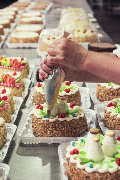 Manual cakes production on factory - Royalty-free Stock Photo | Dissolve