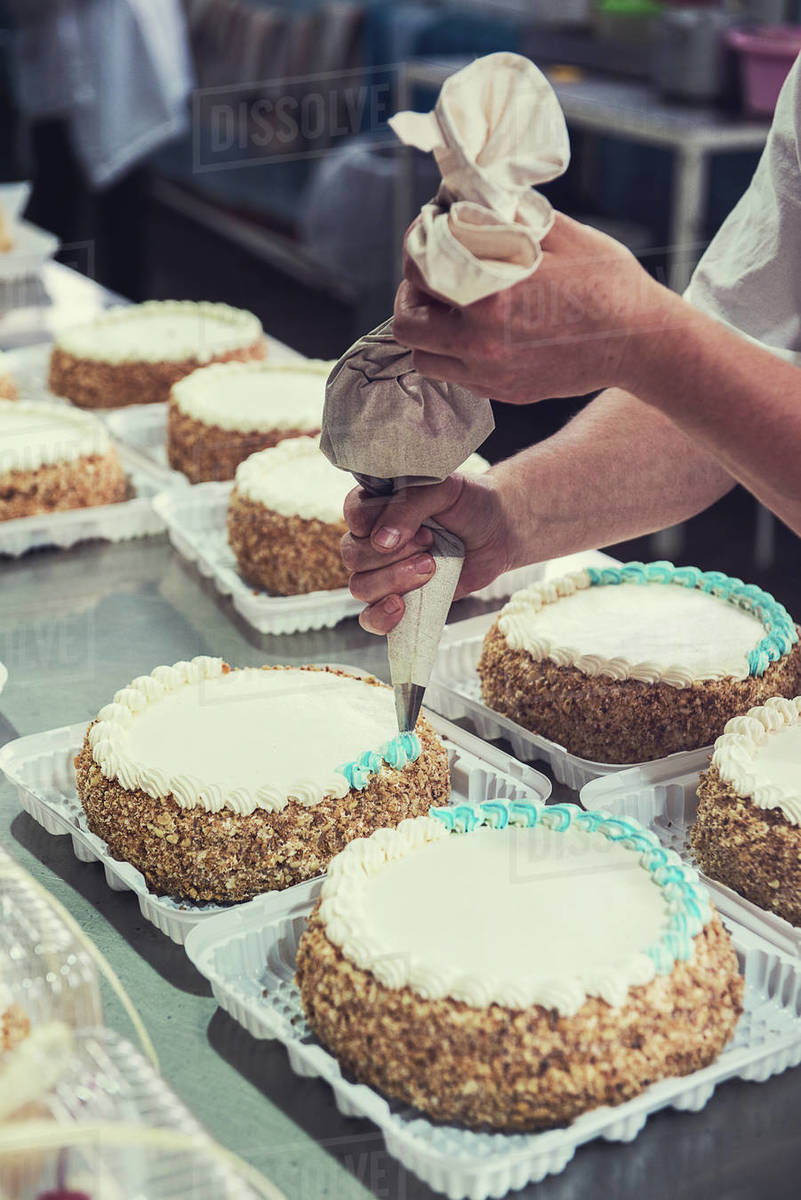 Manual cakes production on factory - Royalty-free Stock Photo | Dissolve