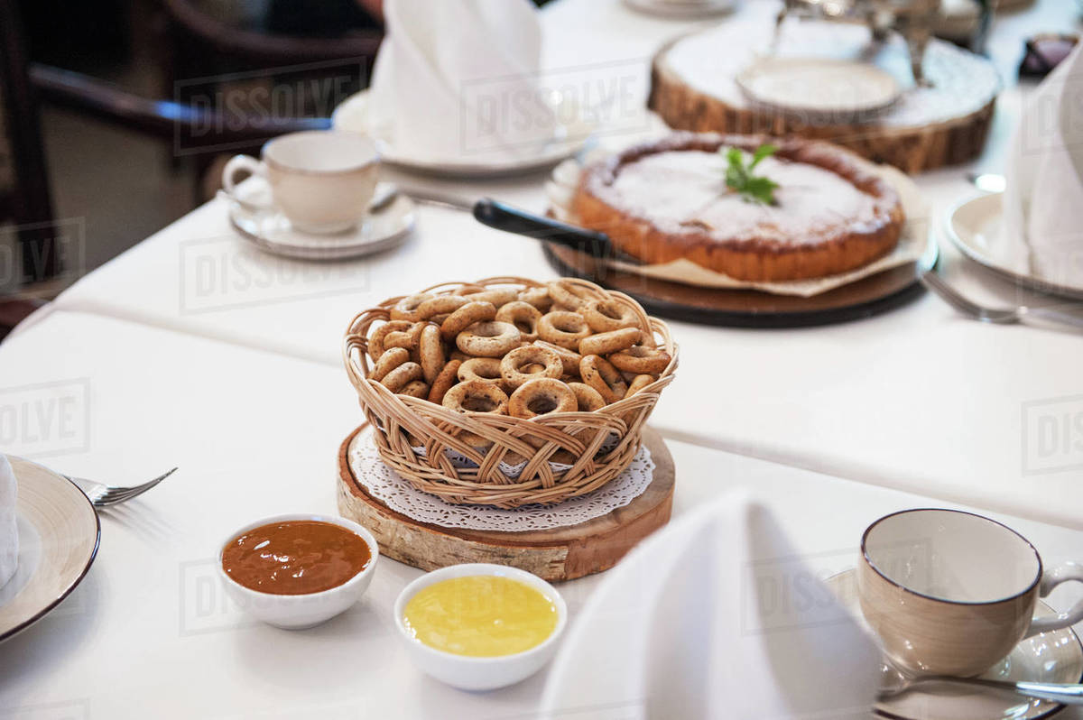 Traditional russian baked goods: pies and pretzels, samovar, honey, jam ...