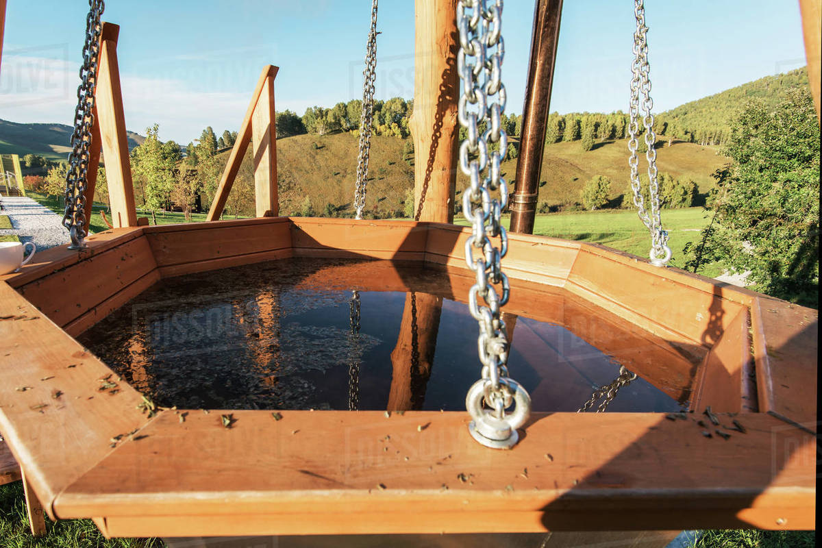 Big vat with hot water and herbs for bathing, spa and relax. Outdoor in ...