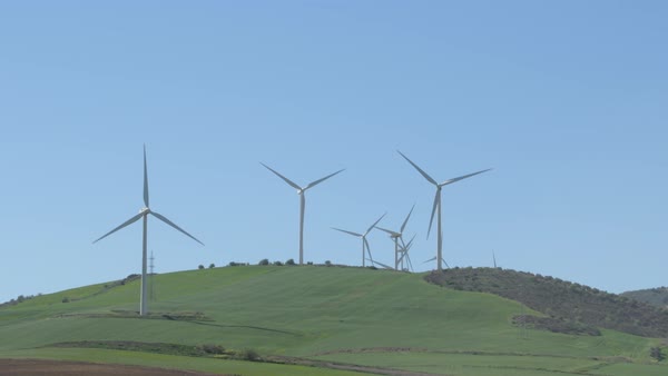 Landscape of wind turbines of renewable energy in the field moving with ...