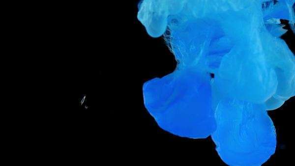 Close-up timelapse footage of a blue precipitate forming from the ...