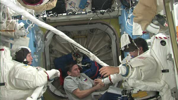 Floating inside Node 1, Unity, Russian cosmonaut Yuri Malenchenko (centre) helps NASA flight ...