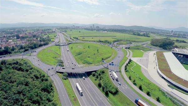 Aerial of roundabout over highway. Huge roundabout over highway with ...