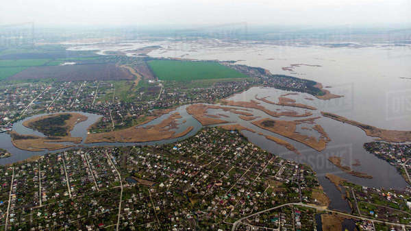 Bird's-eye view to the village, streets, roads, islands and river delta ...