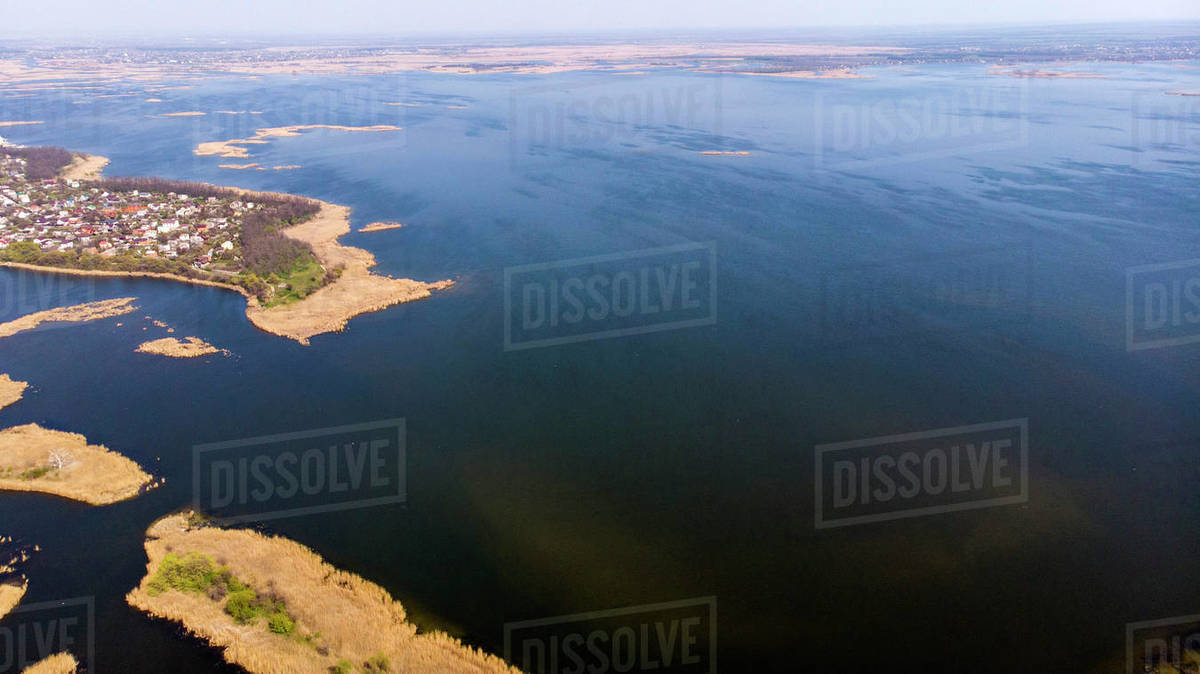 Bird's-eye view to the village, islands and river delta on the skyline ...