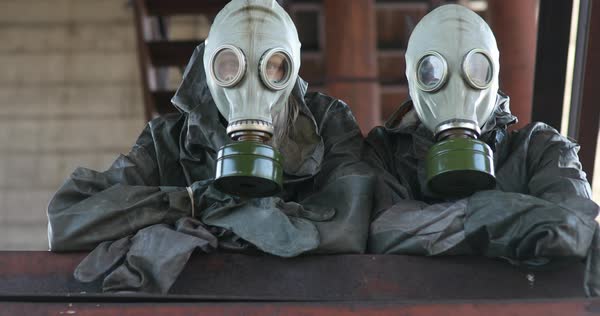 Couple in protective suits and gas masks. - 4K Royalty-free Stock Video ...