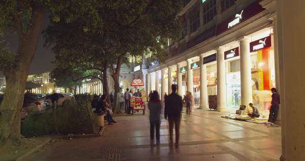 Timelapse of traffic and people at night in Connaught Place, New Delhi ...