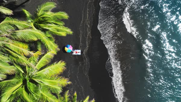 Drone descending above woman sexy red swimsuit enjoying sunshine exotic ...