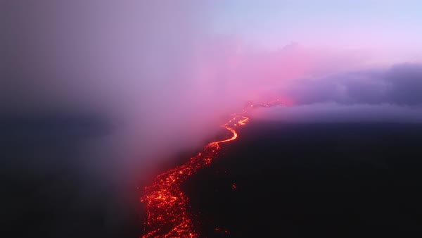 Cinematic magnificent lava river at active volcano eruption Glowing hot ...