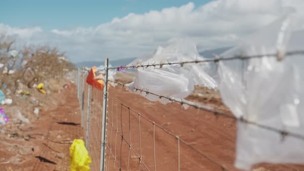 Peoples litter and trash bags flying on wind, Scenic Hawaii plastic ...