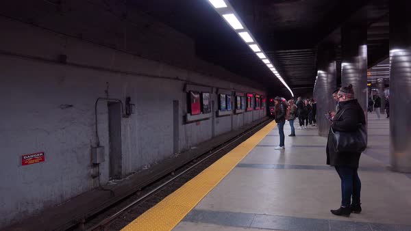 A mbta subway train arrives at a rapid transit station in Boston ...