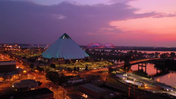 Beautiful night aerial shot of the Memphis pyramid, Hernando De Soto ...
