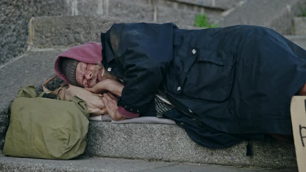 Elderly homeless male sleeping on street stairs, please help sign lying ...