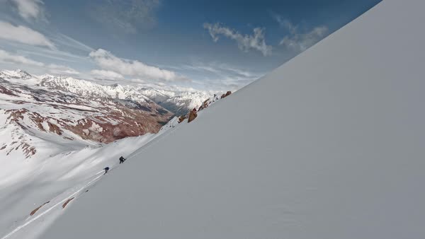 Aerial view epic alpine texture rocky summit climbing people speed dive ...