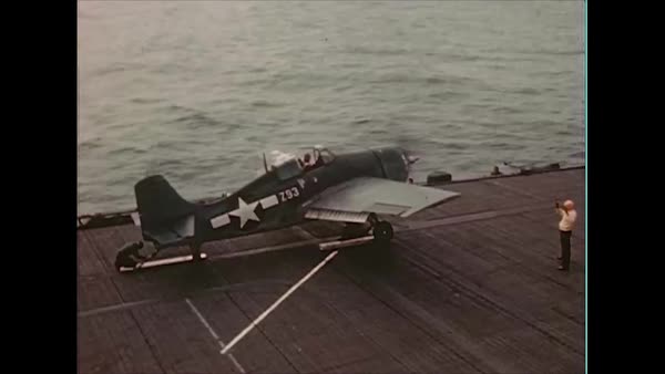 A catapult operator is shown at a control station and equipment is ...