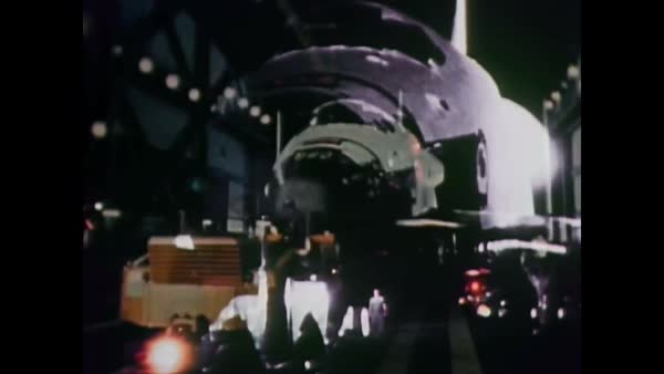 A computer payload operations control center is shown as well as ...