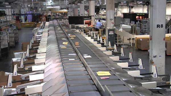 U.S. mail and packages are sorting at a USPS sorting facility. - 720p ...