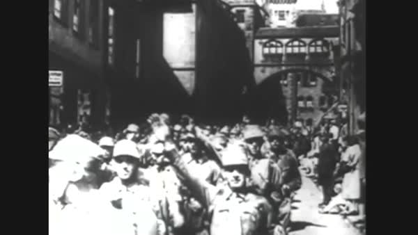 1929 - Large crowds line the streets to salute Hitler's motorcade as it ...