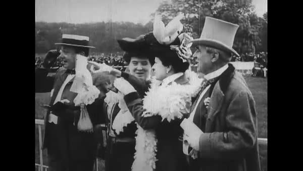 1900s - A crowd of spectators at a racetrack before a steeplechase, in ...