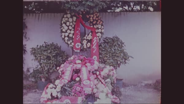 1940s - Wreaths with banners and Nazi swastikas, driving through the ...