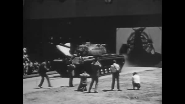 1950 - A 90 mm gun and a machine gun are shown on an M48 Patton main ...